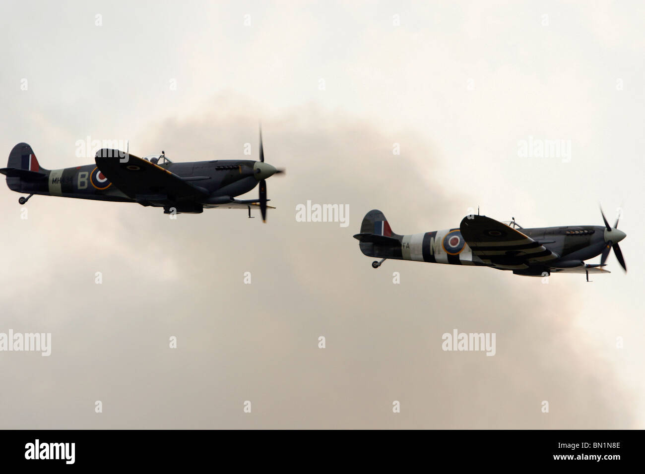 A pair of Second world war Spitfires fly over Kent in England Stock ...