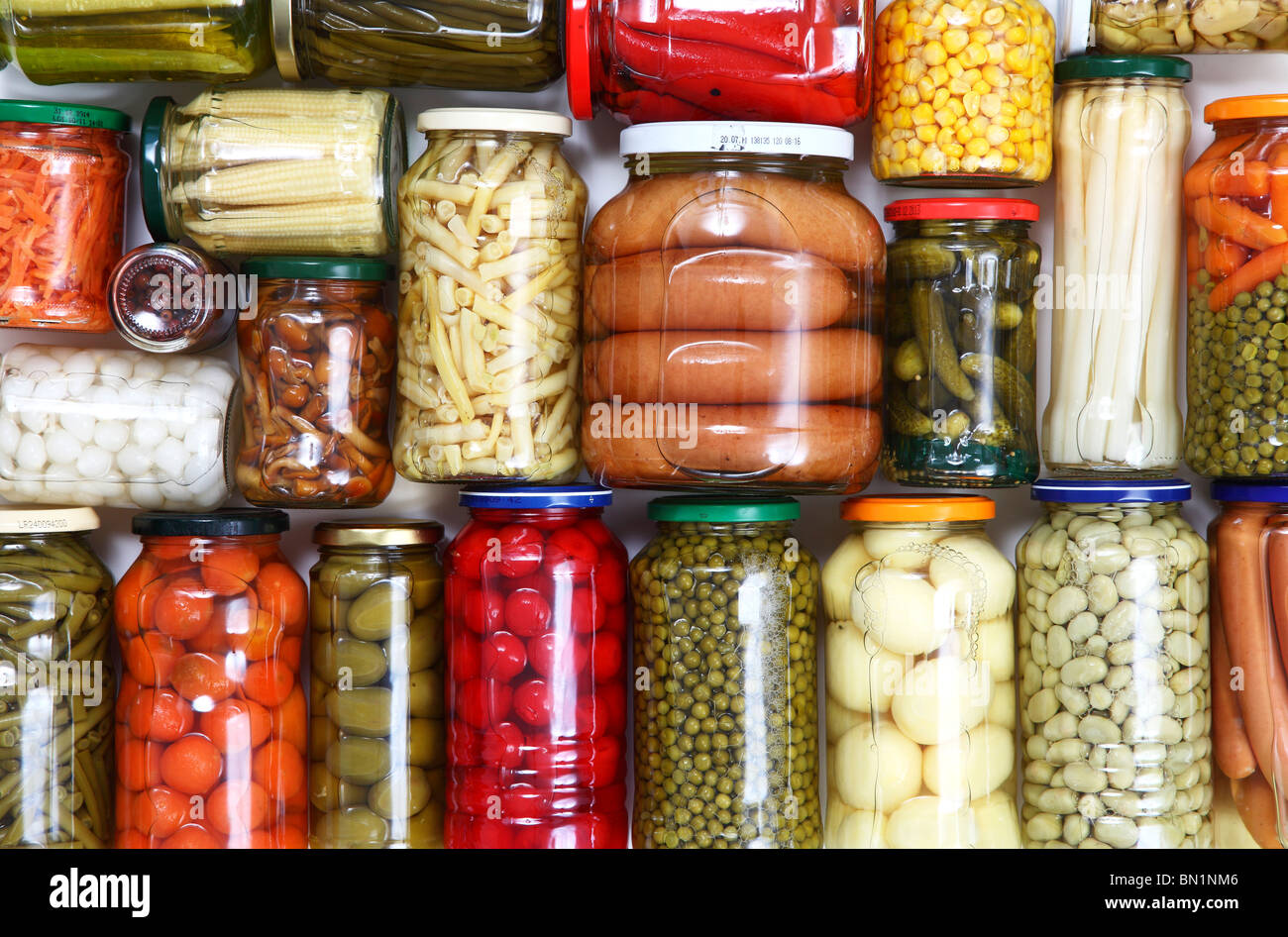 Selection of different food, preserved in glasses. Vegetables, fruits ...