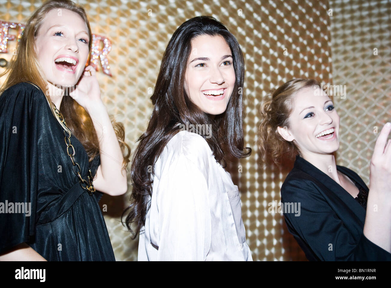 Friends out together at night club Stock Photo - Alamy