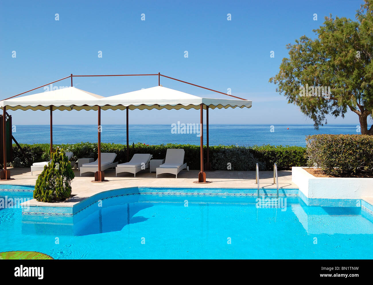 Swimming pool at luxury hotel, Crete, Greece Stock Photo - Alamy