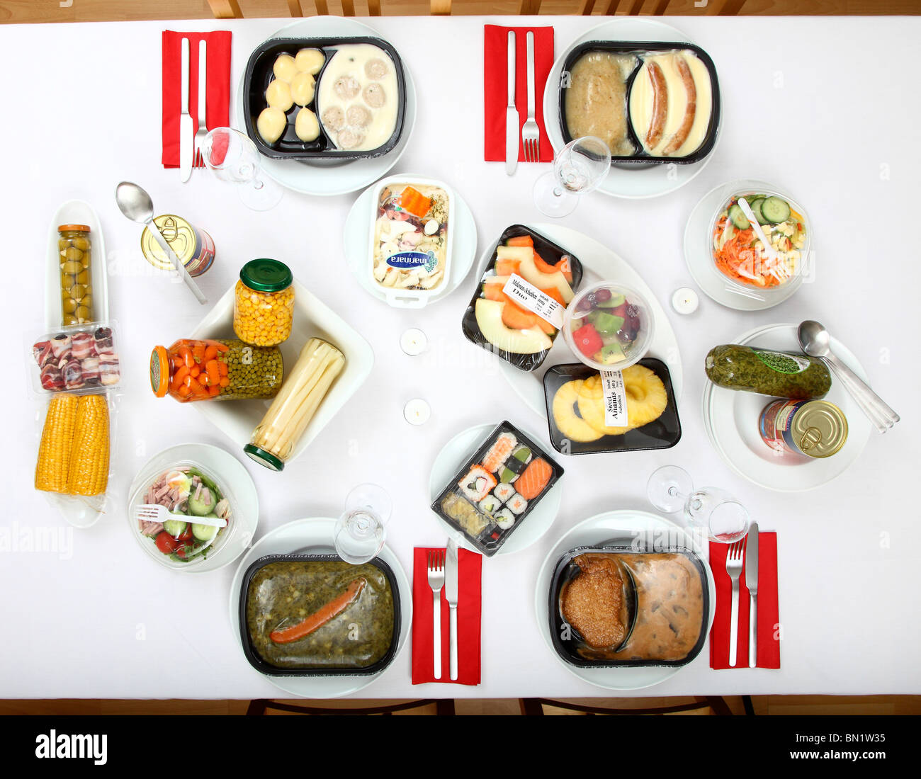 Table, decorated with different convenience food products, all ready-to ...