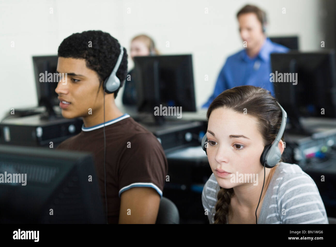 Students learning in computer lab Stock Photo - Alamy