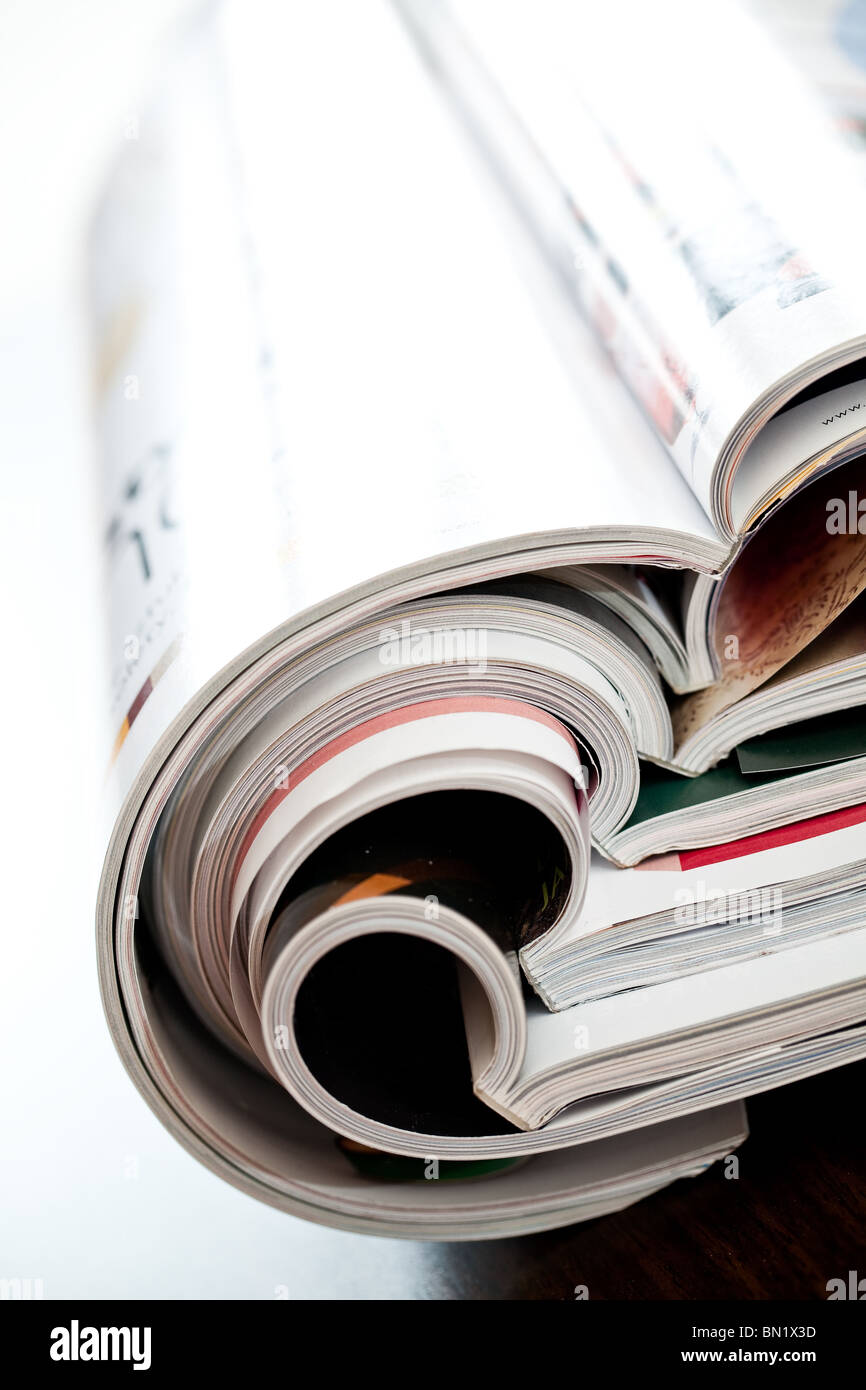 Stack of open colorful magazines - close-up Stock Photo - Alamy
