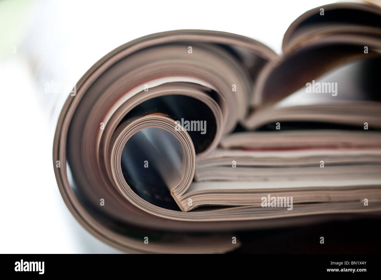 Stack of open colorful magazines - close-up Stock Photo - Alamy