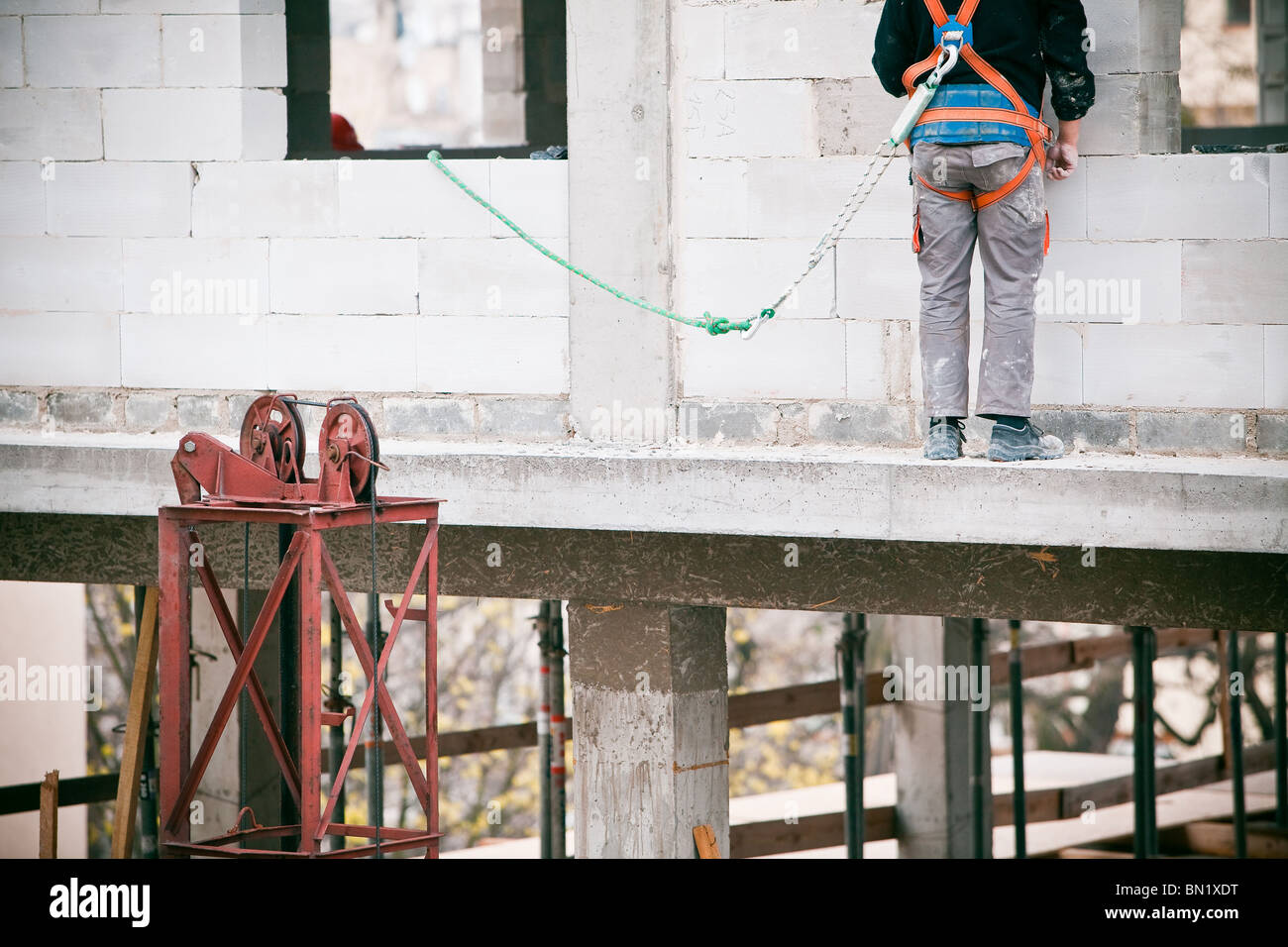 Construction worker working on a construction site Stock Photo - Alamy