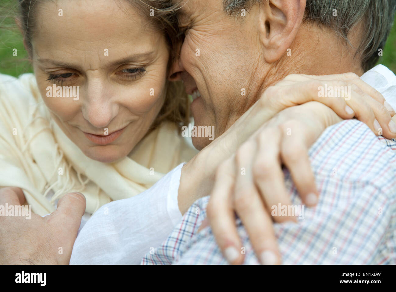 Mature couple embracing Stock Photo - Alamy