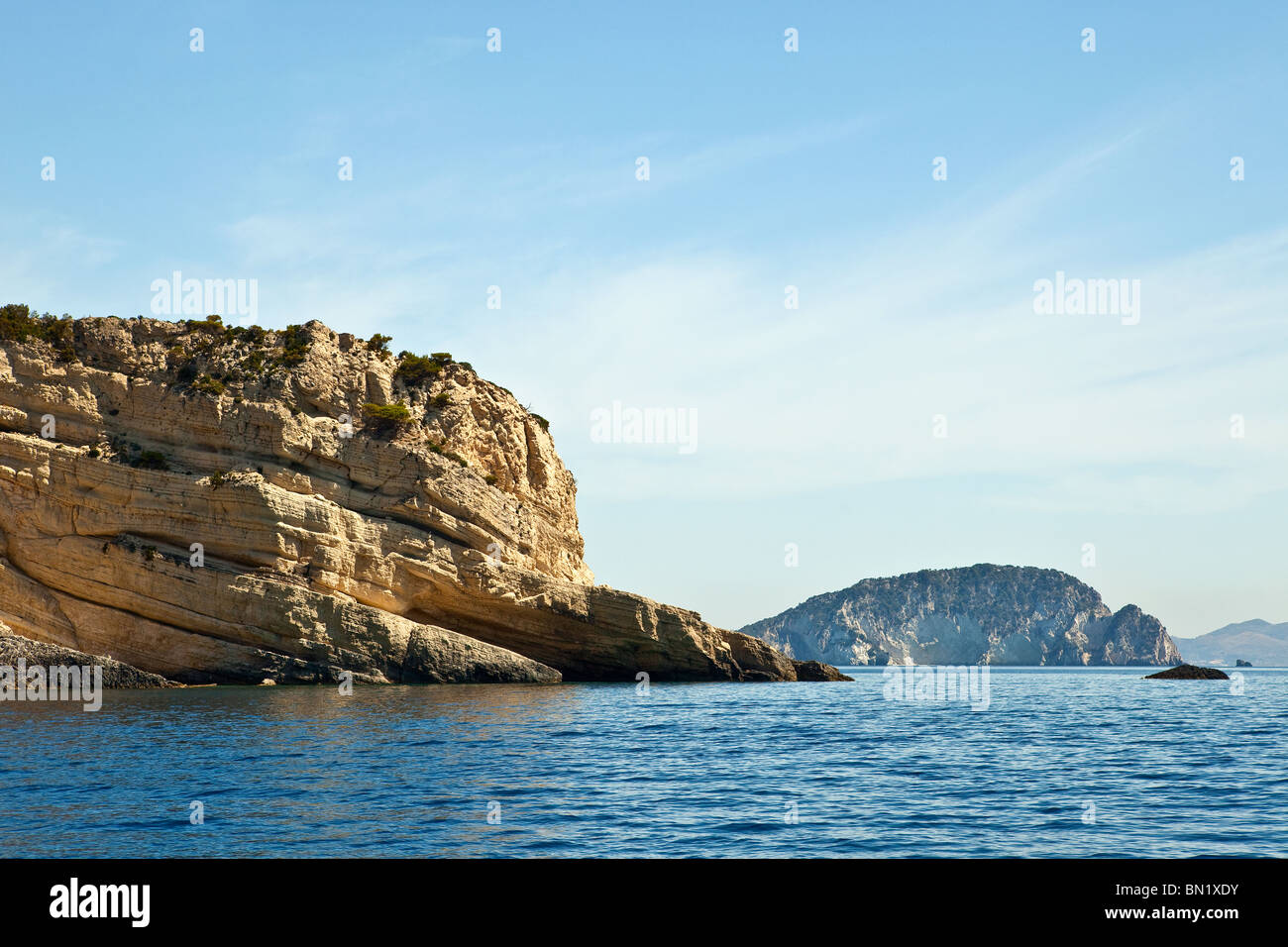 Sea harbor with blue water and blue sky with clouds Stock Photo - Alamy