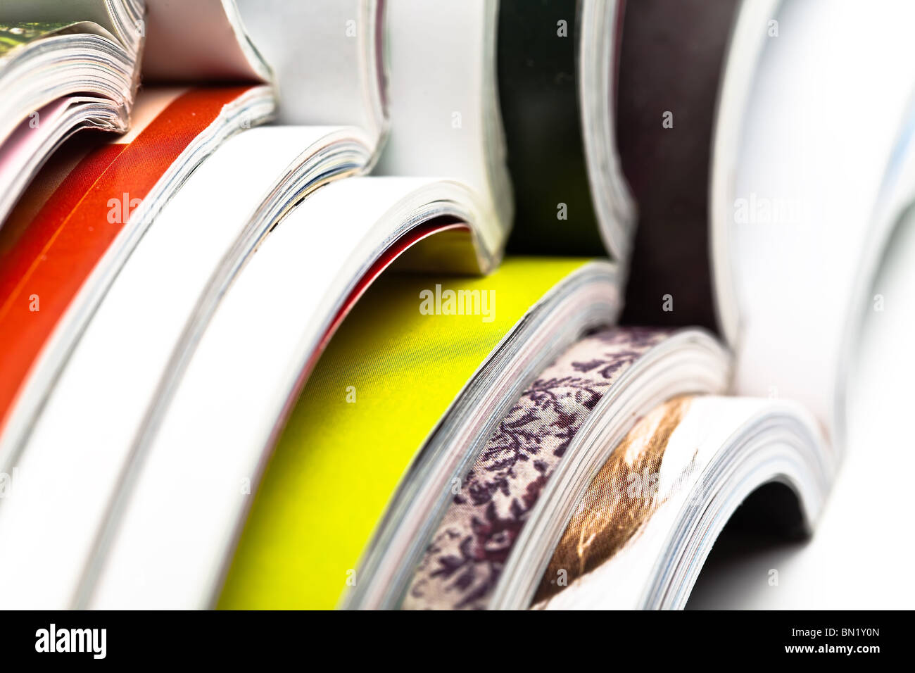 Stack of open colorful magazines - close-up Stock Photo - Alamy