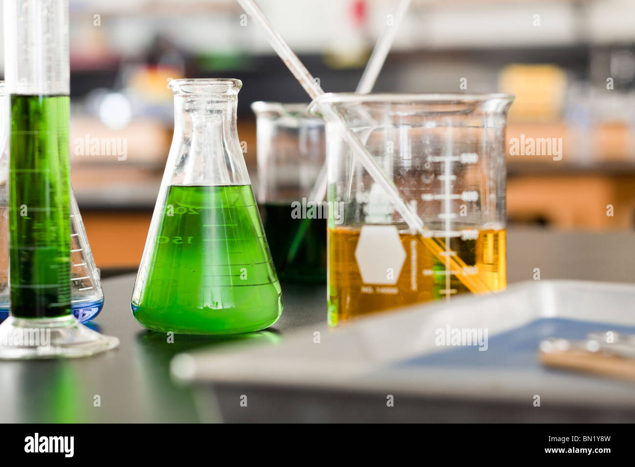 Beakers filled with chemicals Stock Photo - Alamy