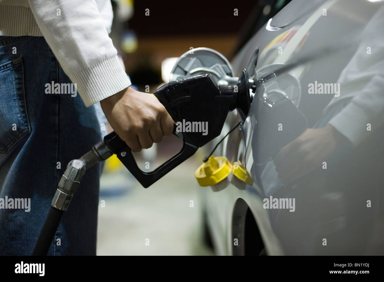Man refueling car night hi-res stock photography and images - Alamy