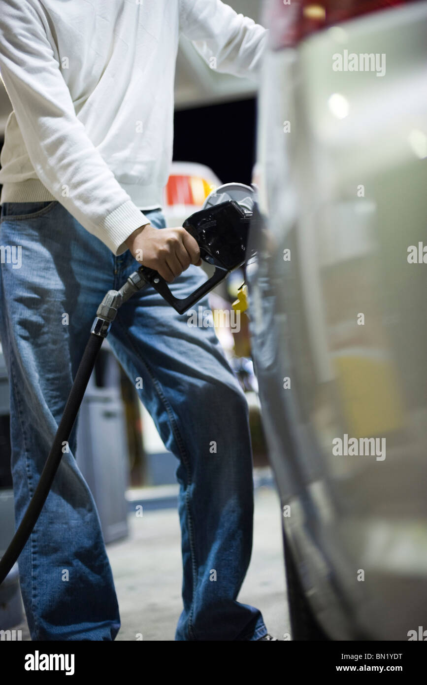 Man refueling car night hi-res stock photography and images - Alamy