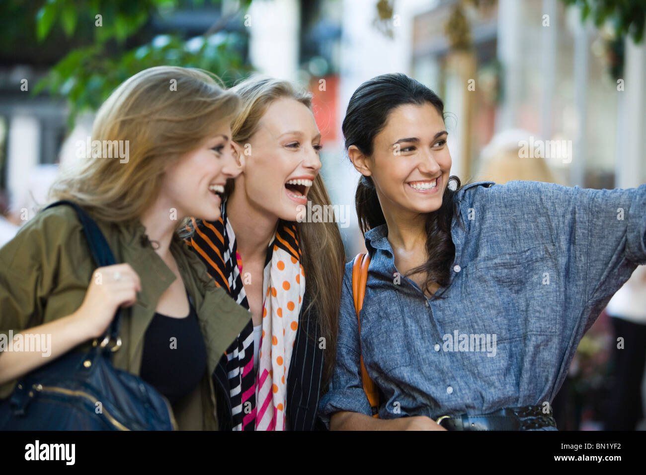 Friends window shopping together Stock Photo - Alamy