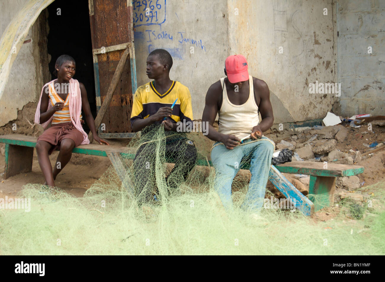Women mending nets hi-res stock photography and images - Alamy