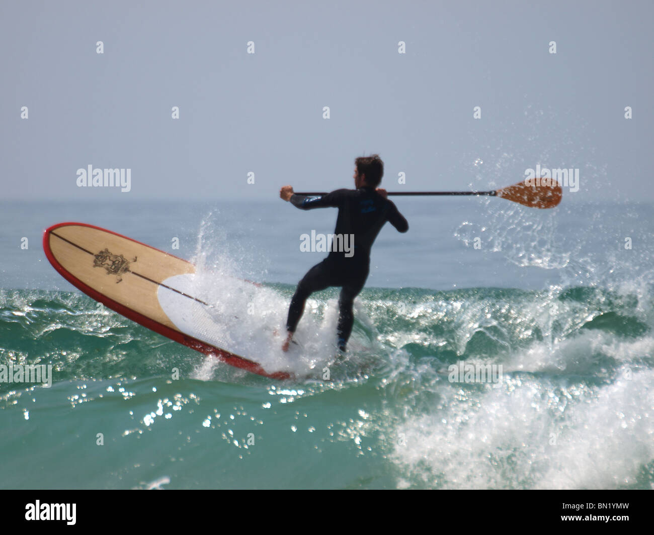 Paddlesurf wetsuit hi-res stock photography and images - Alamy