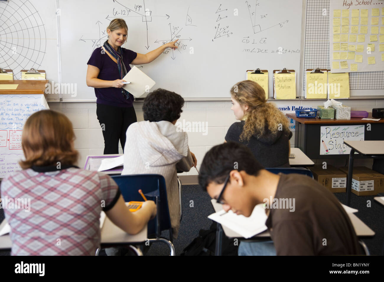 Woman teaching mathematics to high school students Stock Photo - Alamy