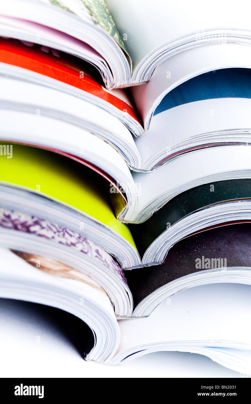 Stack of open colorful magazines - close-up Stock Photo - Alamy
