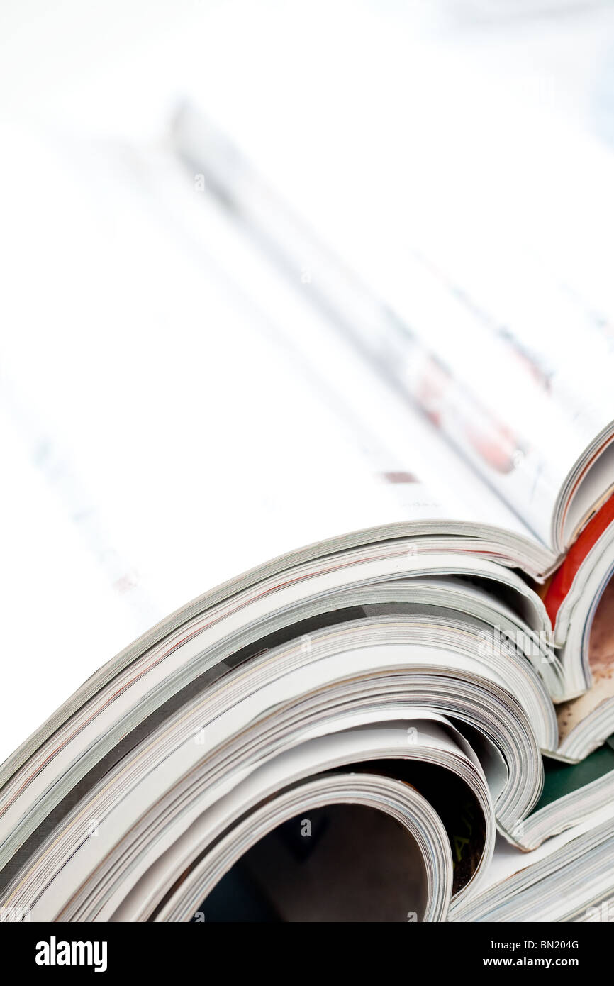 Stack of open colorful magazines - close-up Stock Photo - Alamy