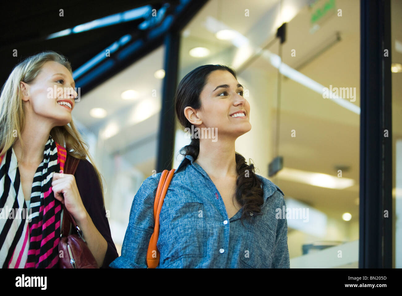 Friends window shopping together Stock Photo - Alamy