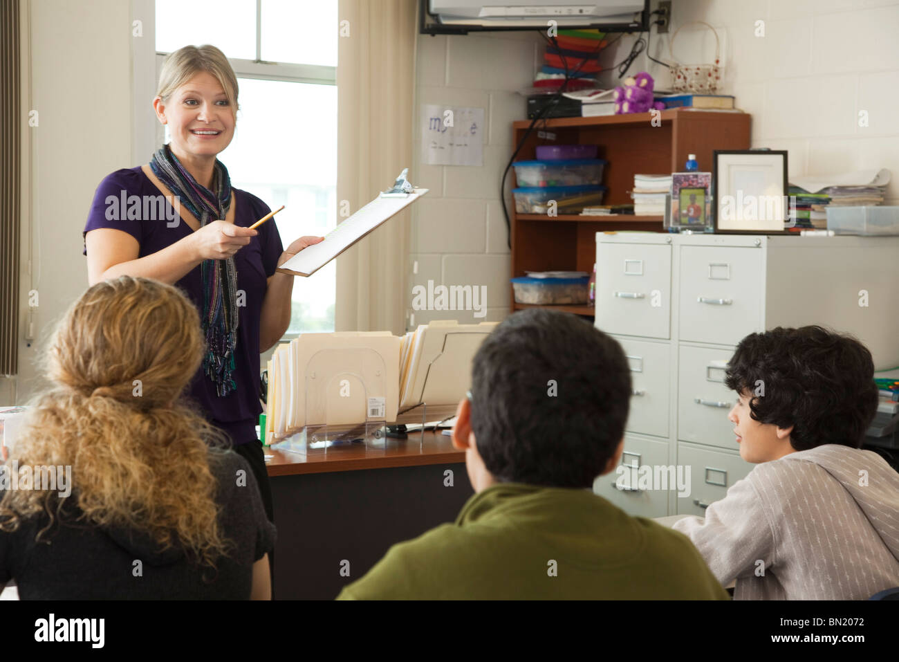 High school teacher addressing students in class Stock Photo - Alamy