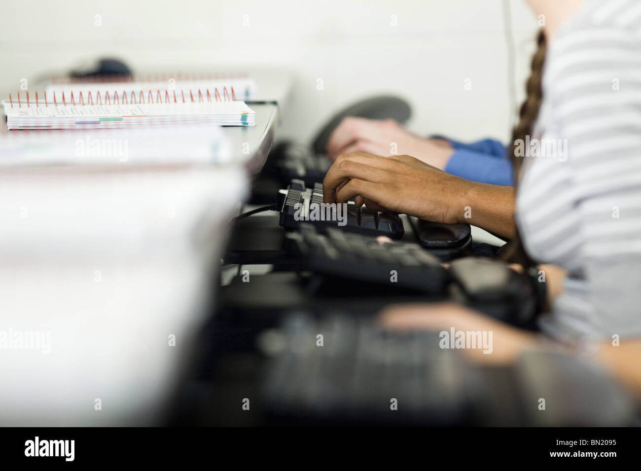 Students typing on keyboards Stock Photo - Alamy