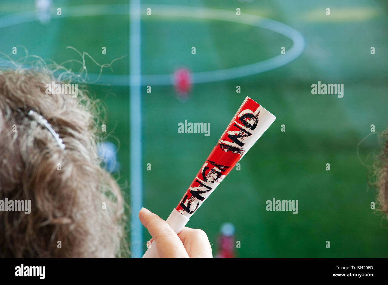 England fan watching world cup match on pub screen with vuvuzela Stock ...