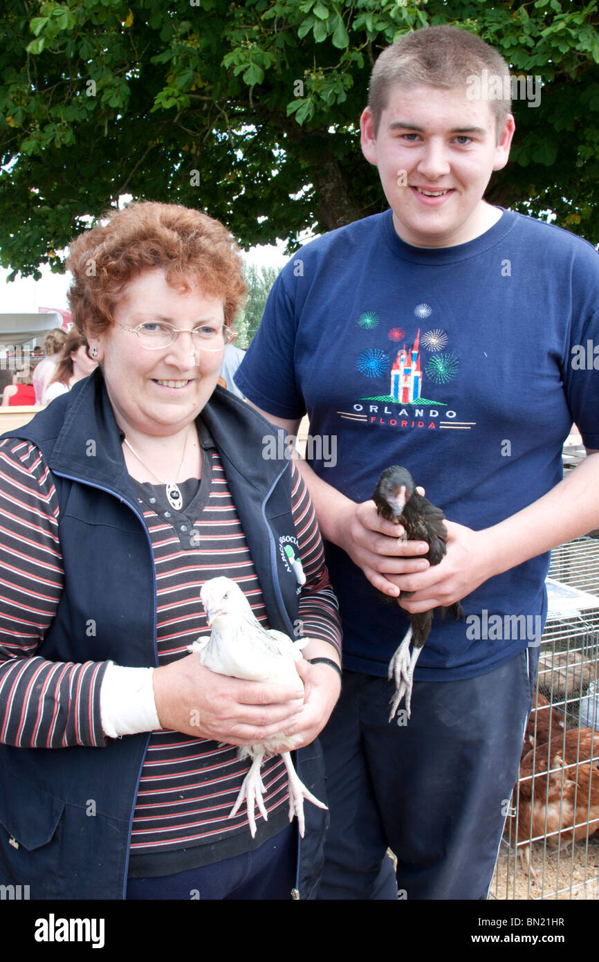 Mother and son holding cage birds, Limerick Ireland Stock Photo - Alamy