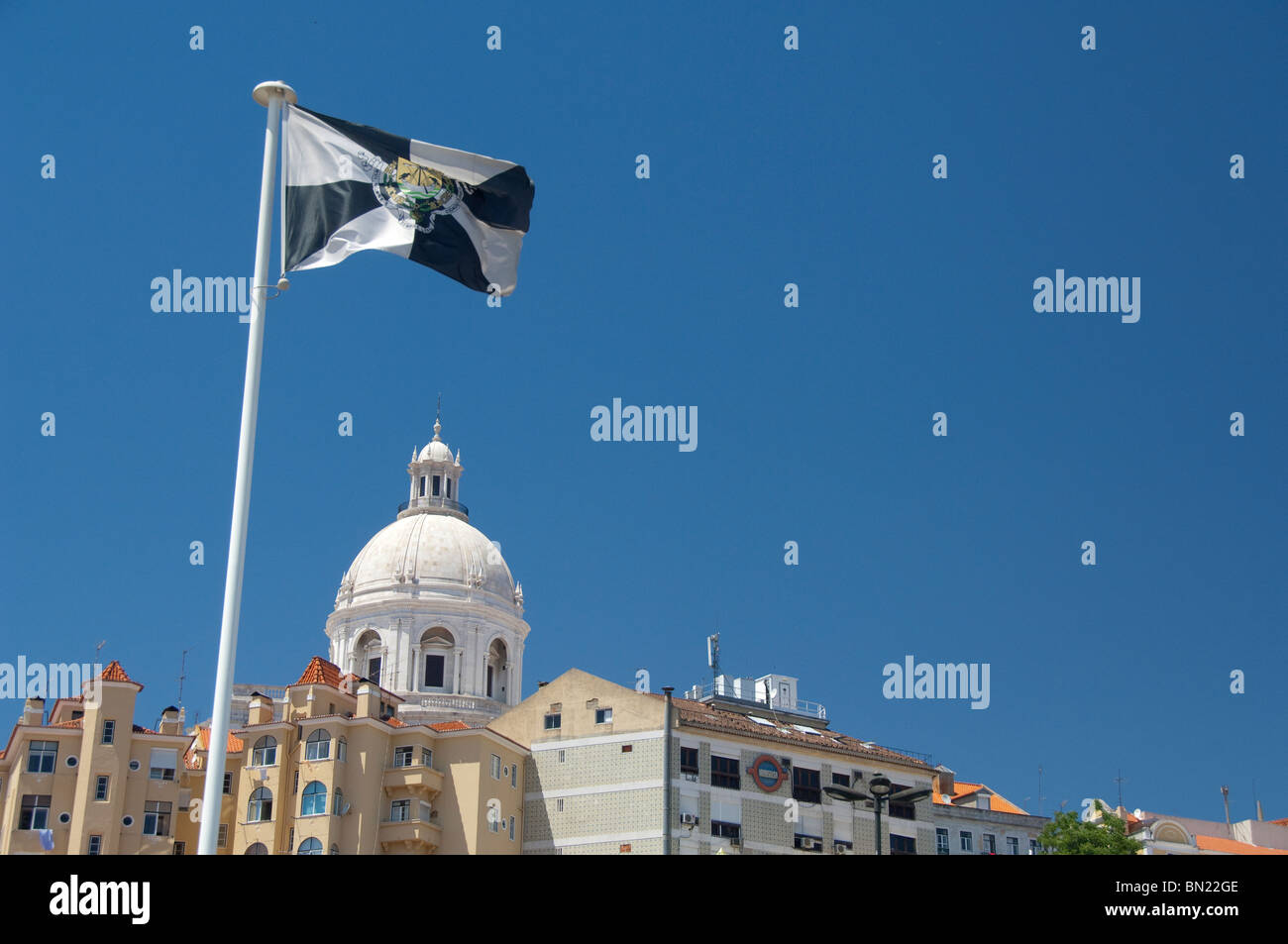Europe, Portugal, Lisbon (aka Lisboa). Flag in front of baroque dome of ...