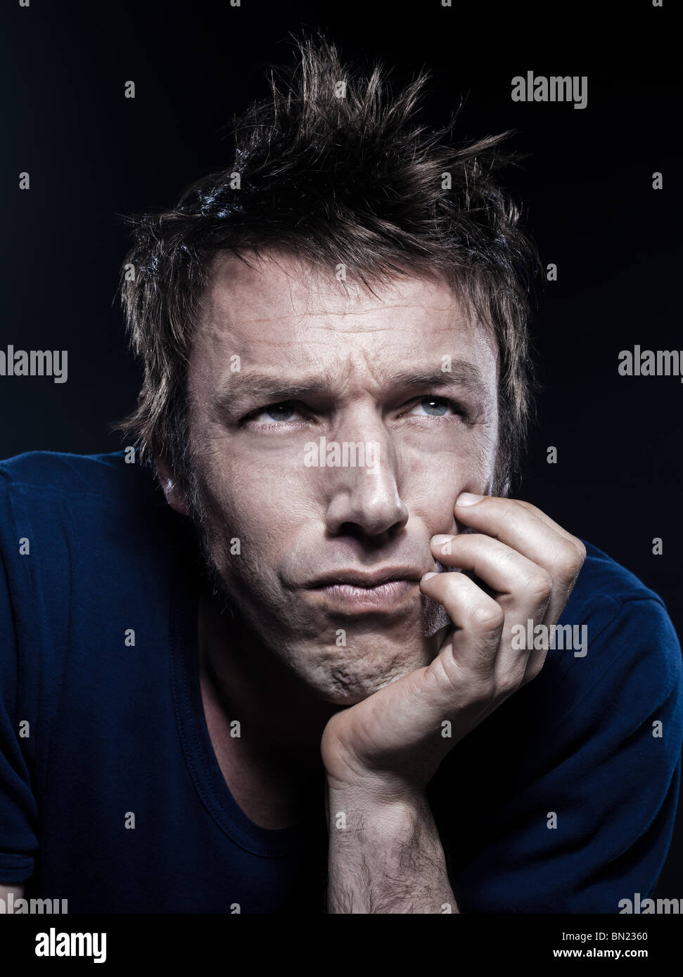 studio portrait on black background of a funny expressive caucasian man ...