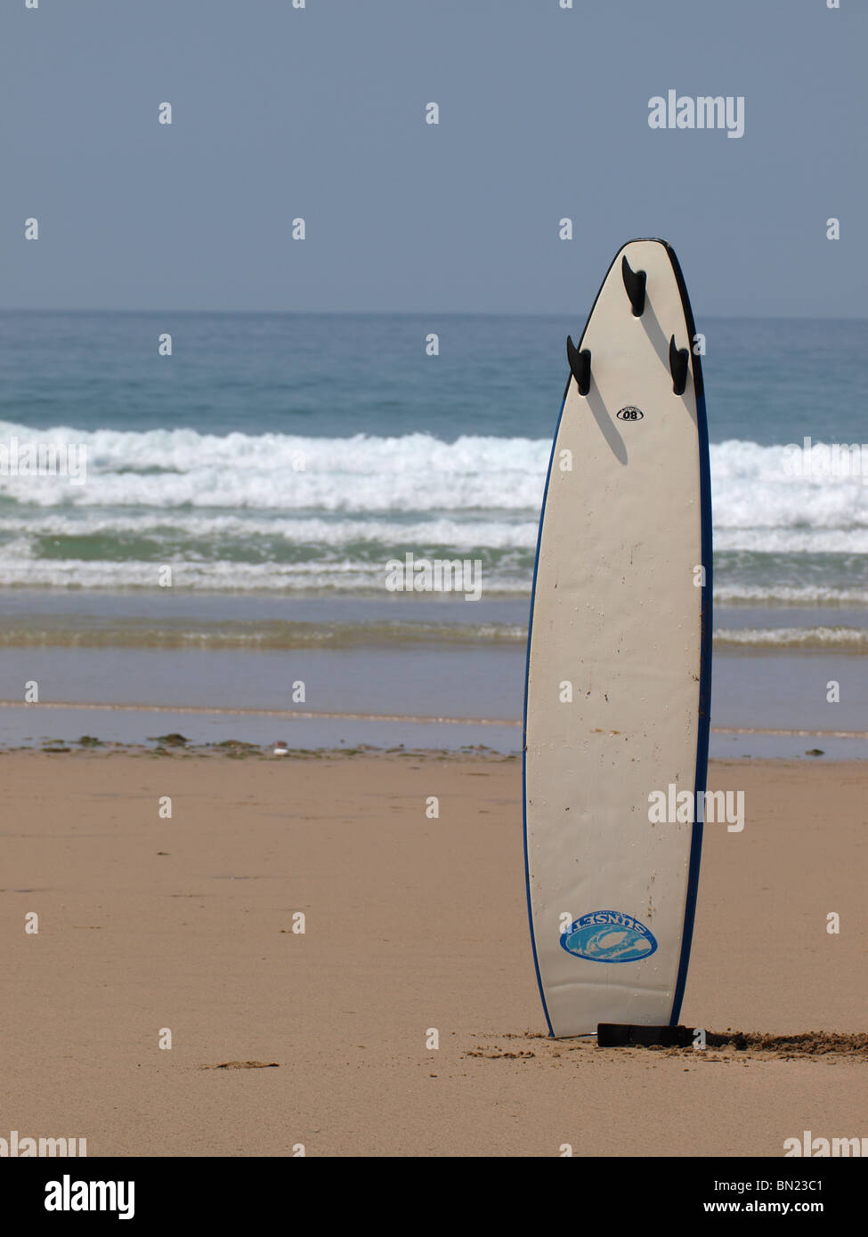 Surfboard upright in the sand, Watergate Bay, Cornwall, UK Stock Photo ...