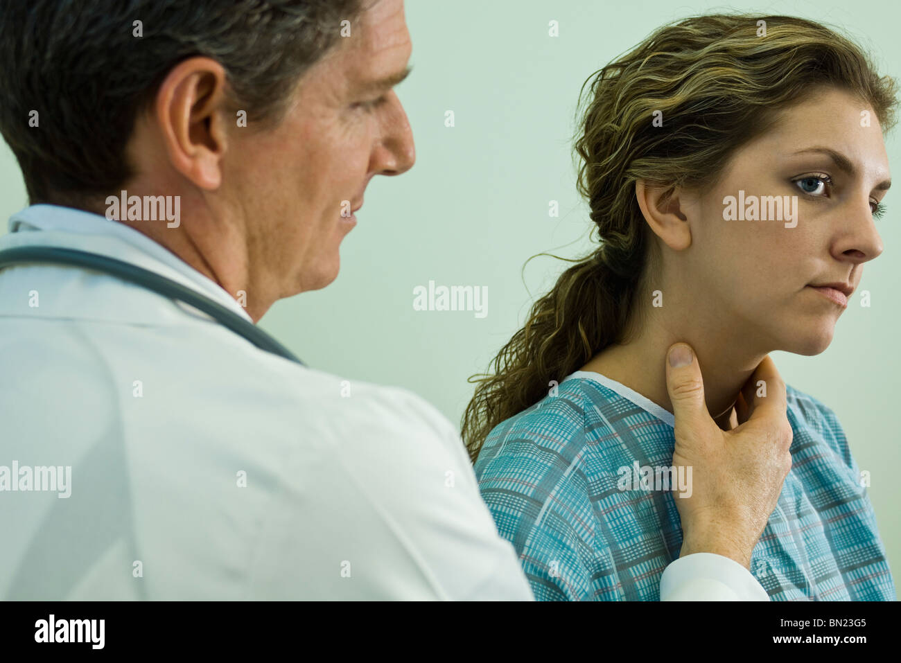 Doctor examining patient's lymph nodes Stock Photo - Alamy