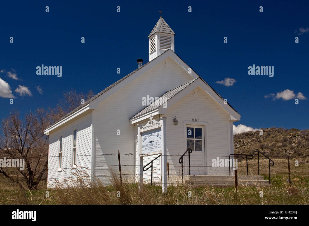 Old historic wooden white clapboard church in Virgina Dale Colorado ...