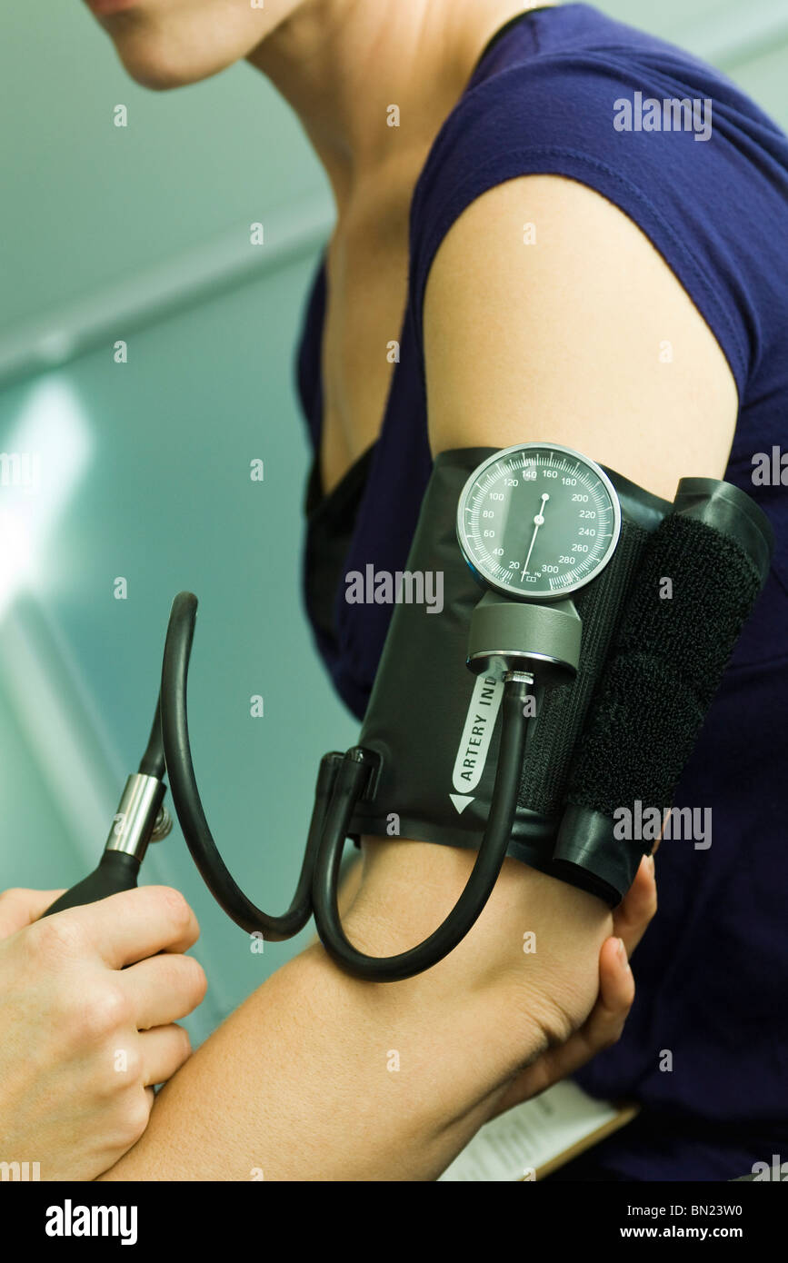 Patient having blood pressure checked Stock Photo - Alamy