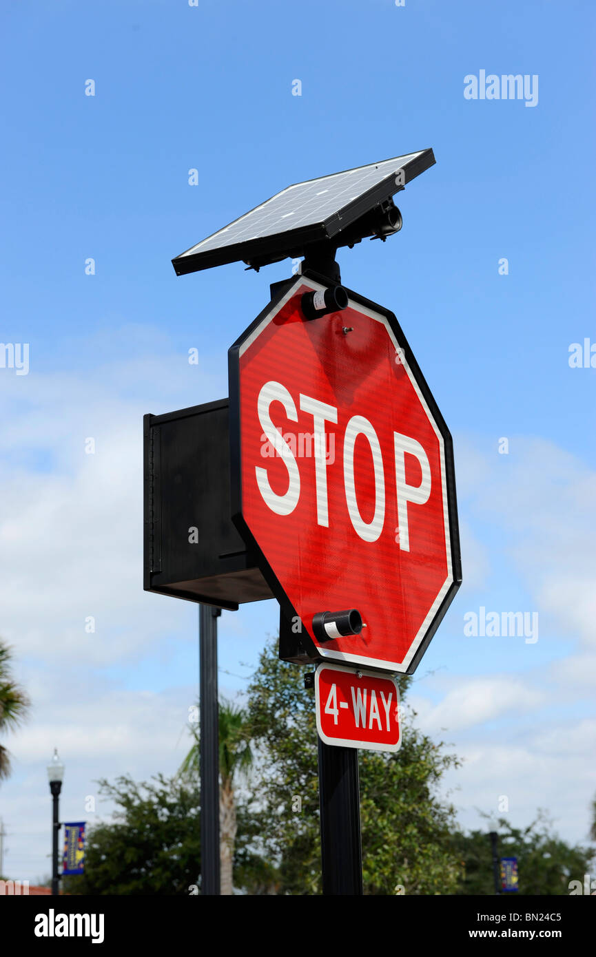 Lighted stop sign powered by solar panel energy Stock Photo - Alamy
