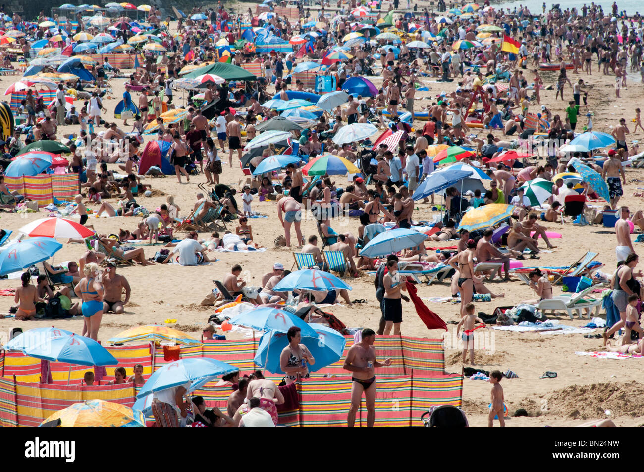 A crowded Margate Beach on a hot summer weekend, England Stock Photo ...
