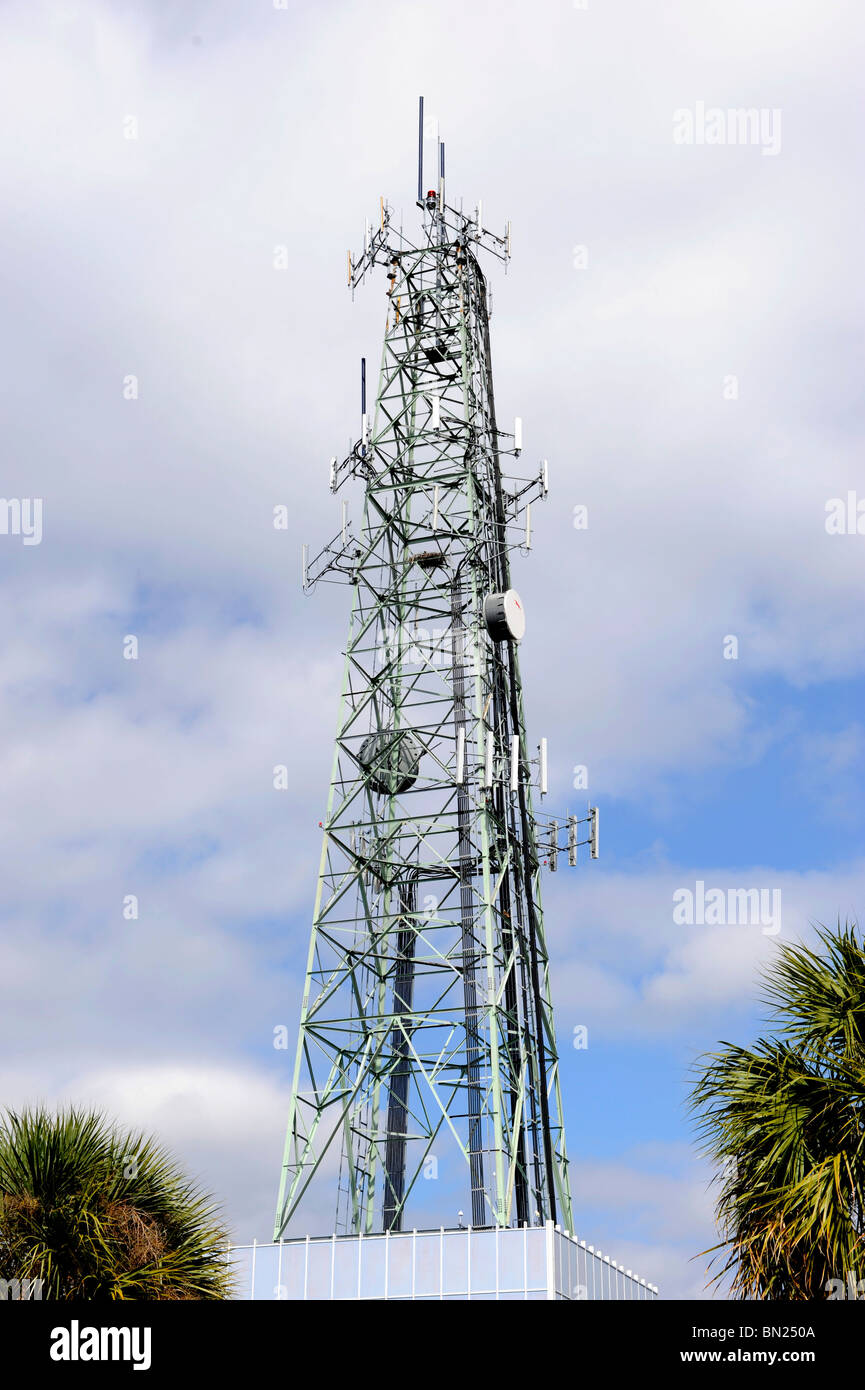Cellular telephone tower with microwave transmission dishes mounted to ...