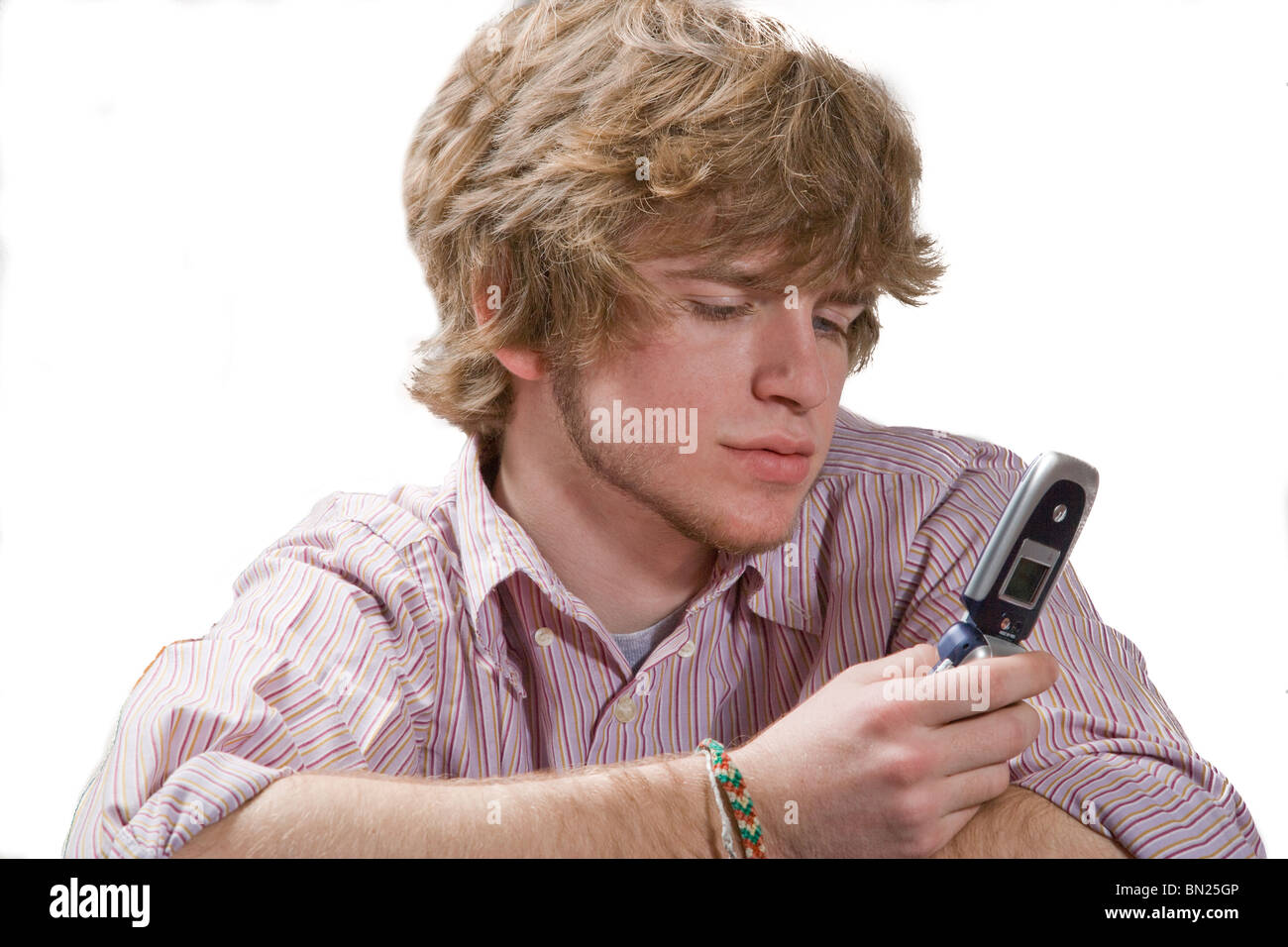 Caucasian teenage boy using his cell phone Stock Photo - Alamy