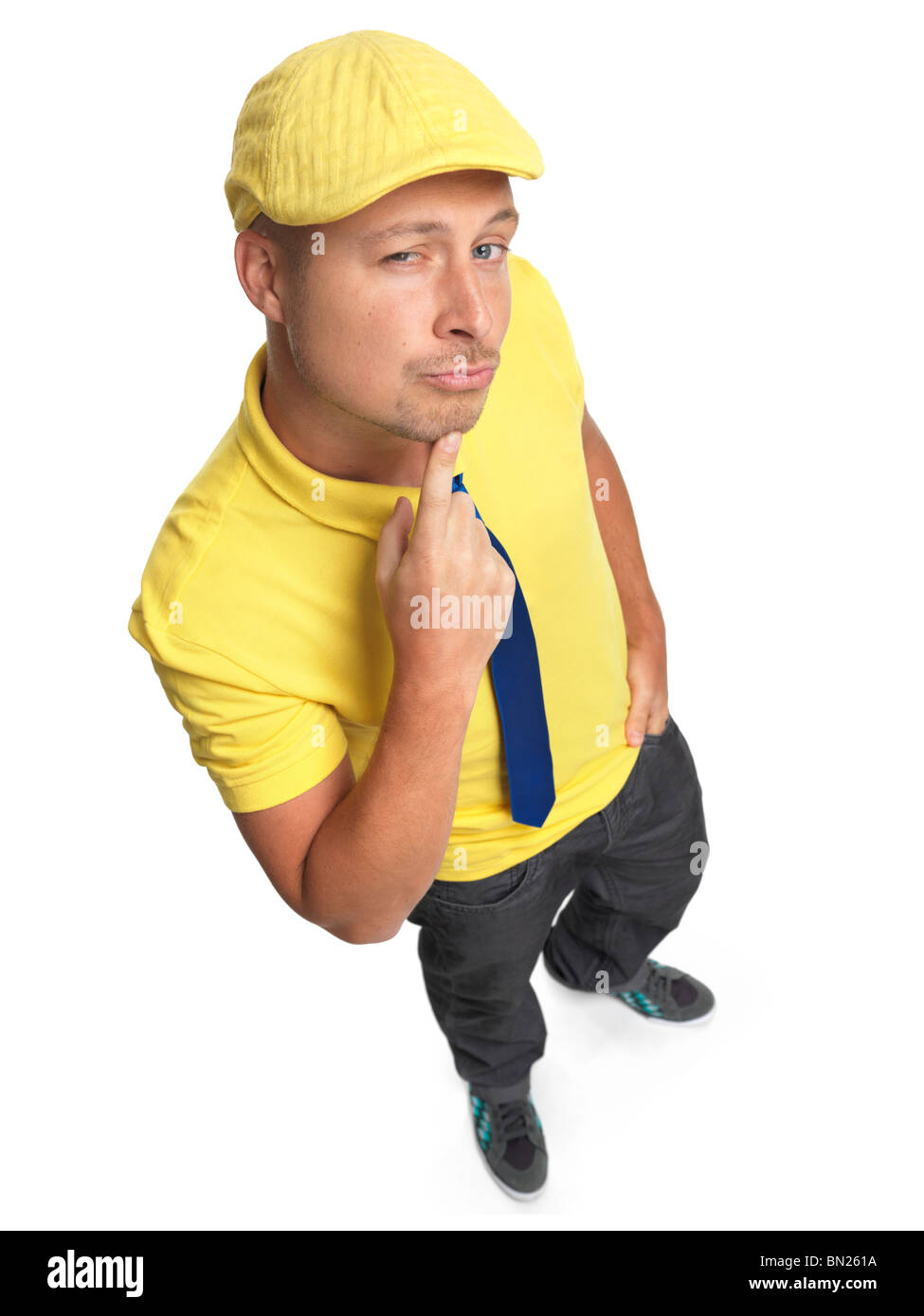 Thoughtful young man looking up at the camera. Isolated on white ...