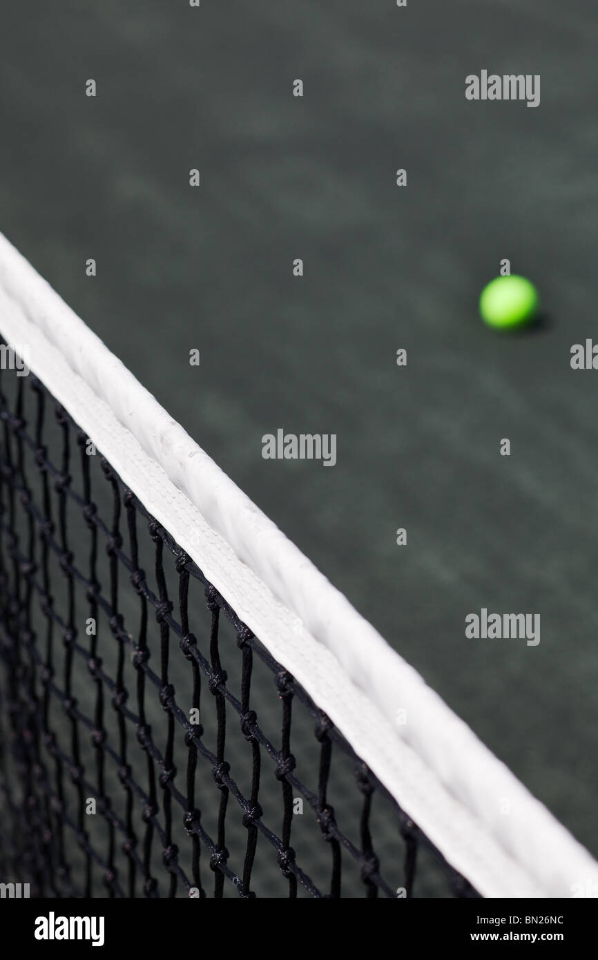 tennis court with net and ball background Stock Photo - Alamy