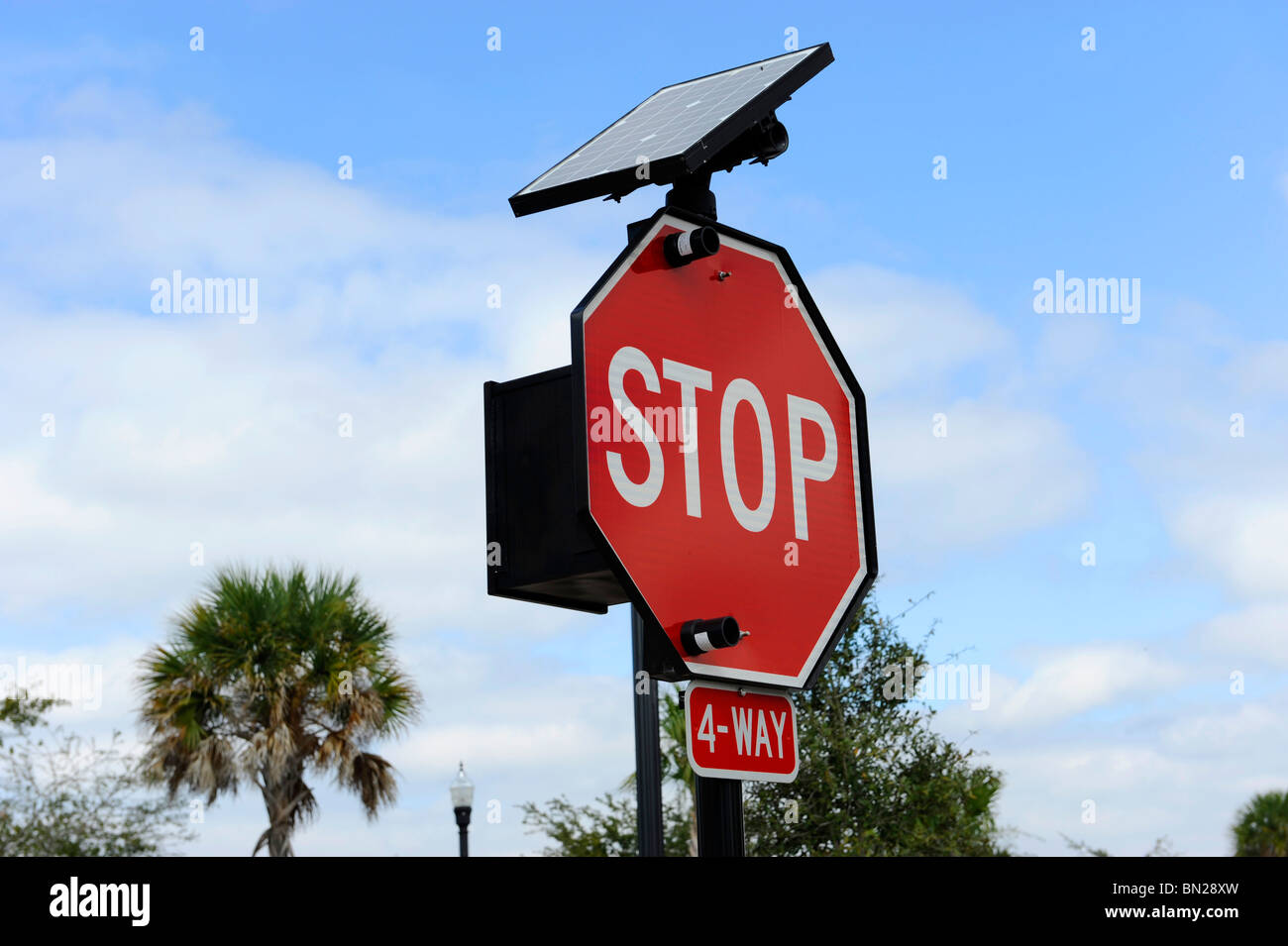 Lighted stop sign powered by solar panel energy Stock Photo - Alamy