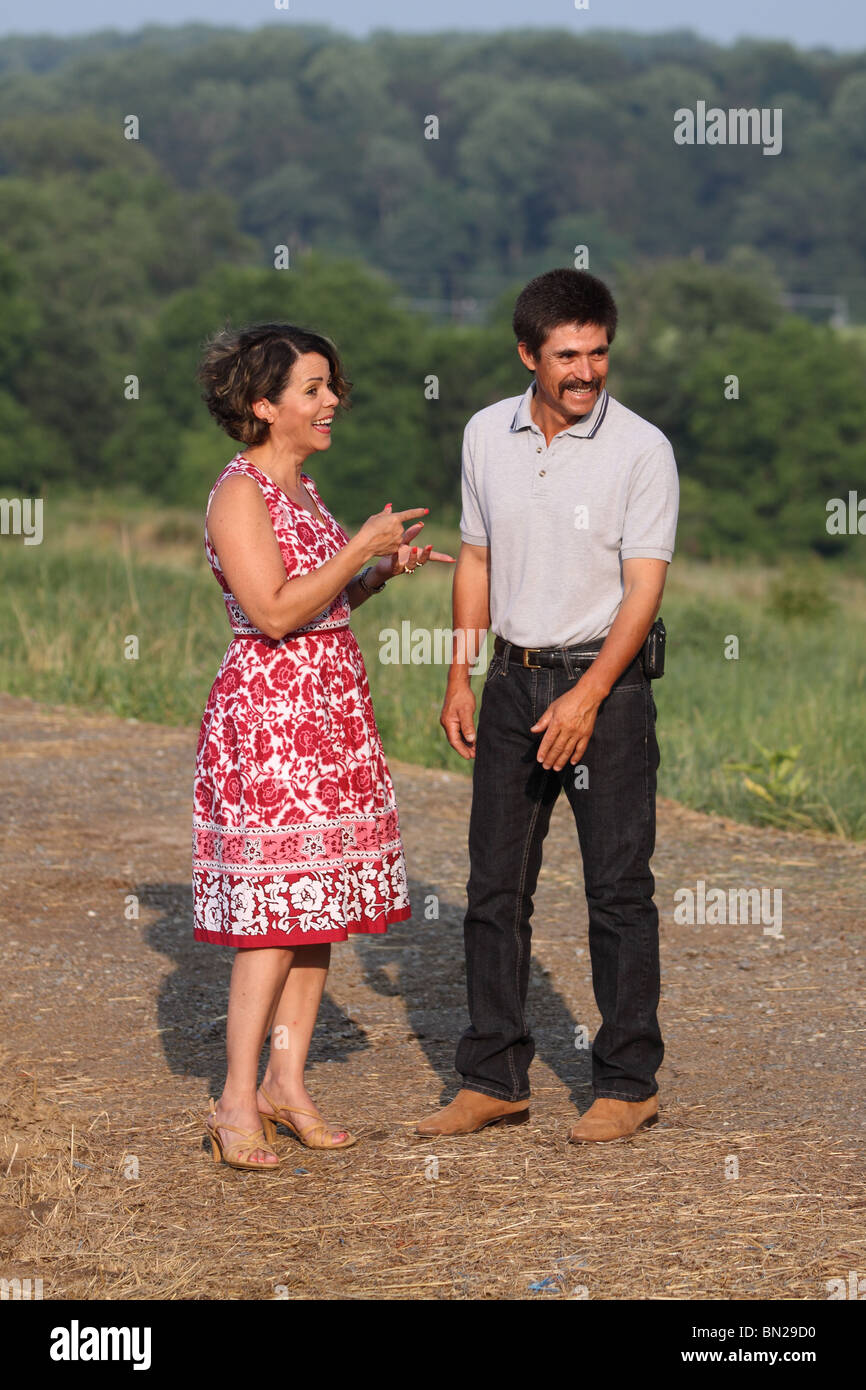 Hispanic couple in the summer talking and laughing Stock Photo - Alamy