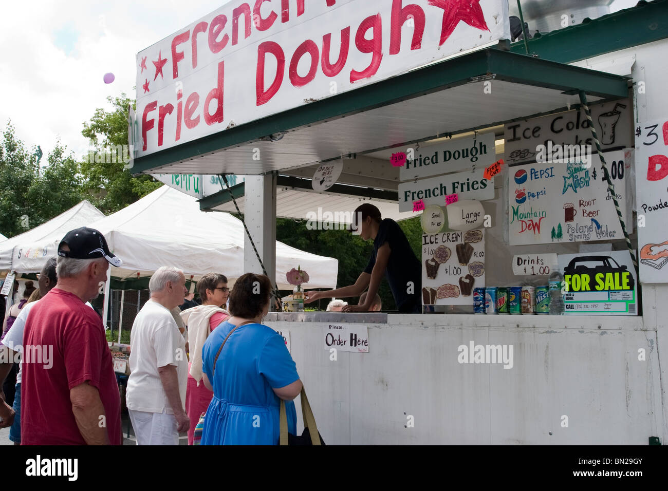 Fried dough and French fries are sold at a fair in Massachusetts Stock ...