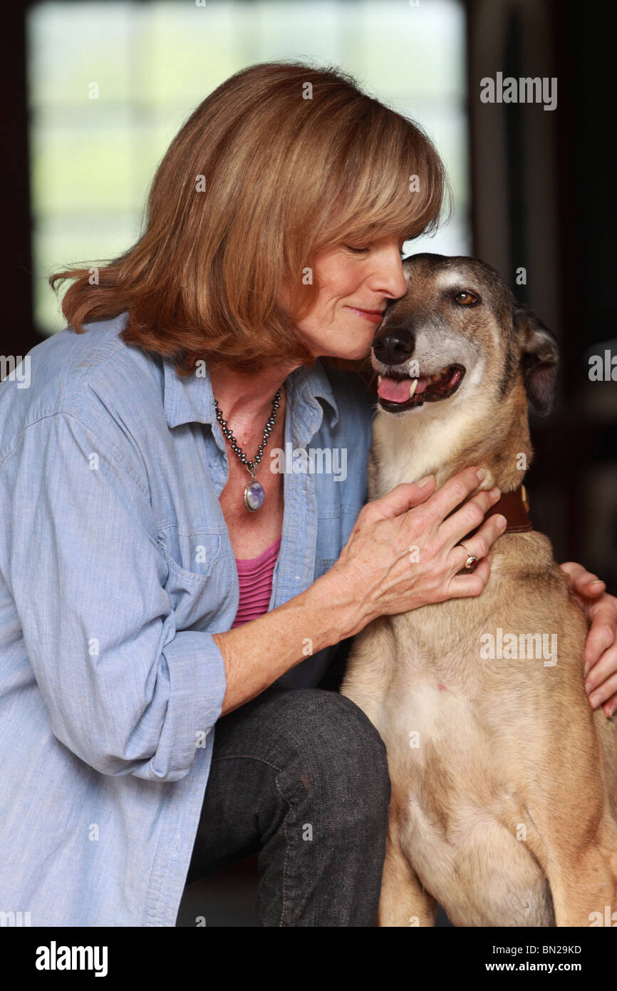beautiful mature woman with dog Stock Photo - Alamy