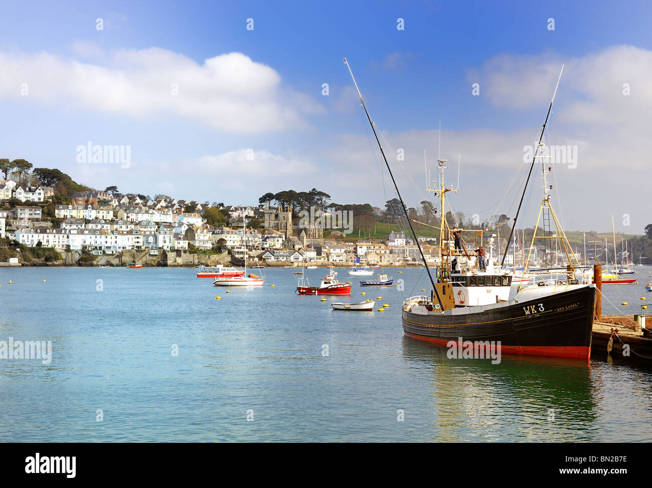 Fishing boat docked in port with Fowey in background Stock Photo - Alamy