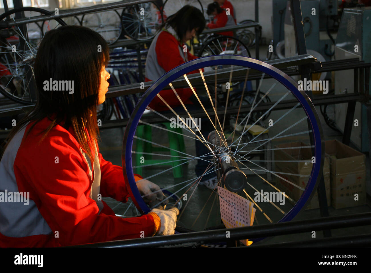China, Beijing, Bicycle factory making a wheel Stock Photo - Alamy