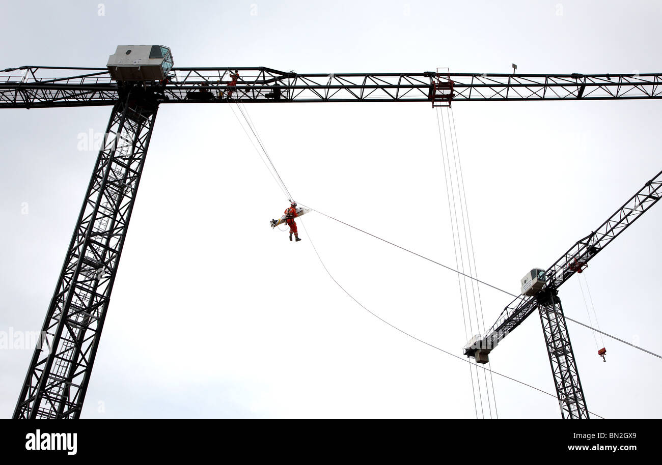 A crane driver is rescued during a fireman crane rescue, from a ...