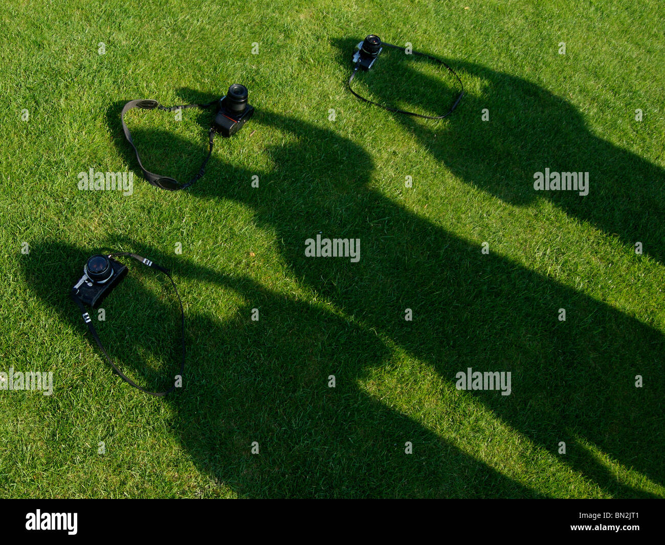 Three photographer shadows with manual slr cameras Stock Photo - Alamy