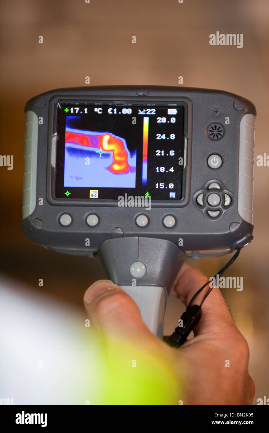 A thermal imaging camera shows heat loss from a hot water pipe Stock ...