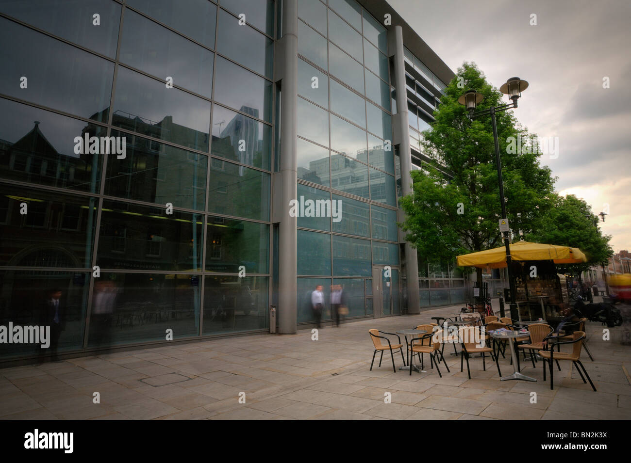 london city street at at day time cars and people going by Stock Photo ...