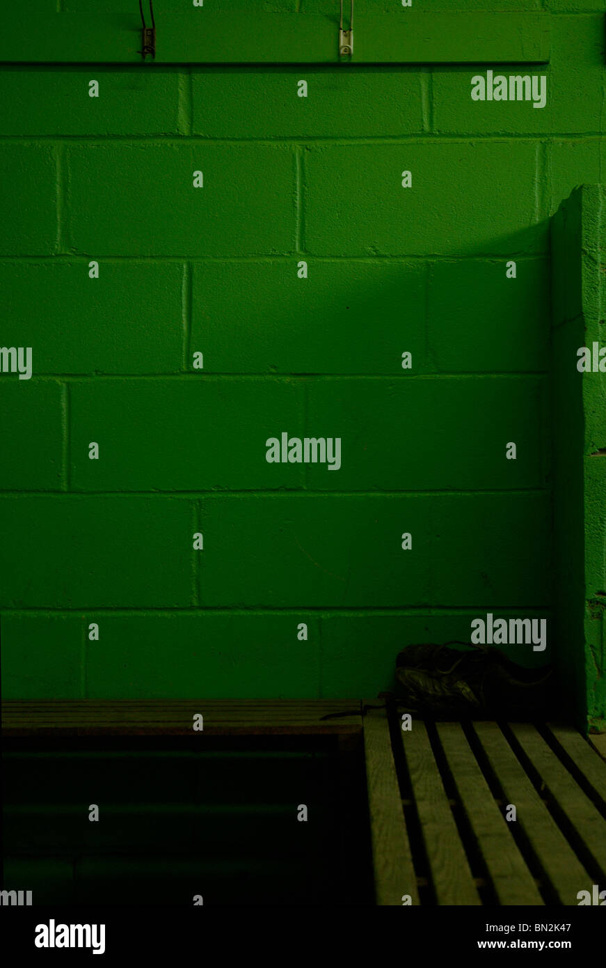 Interior of a changing room with green walls Stock Photo - Alamy