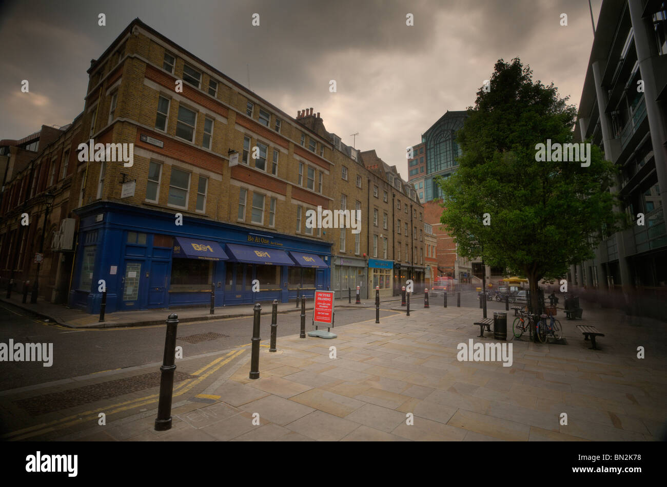london city street at at day time cars and people going by Stock Photo ...